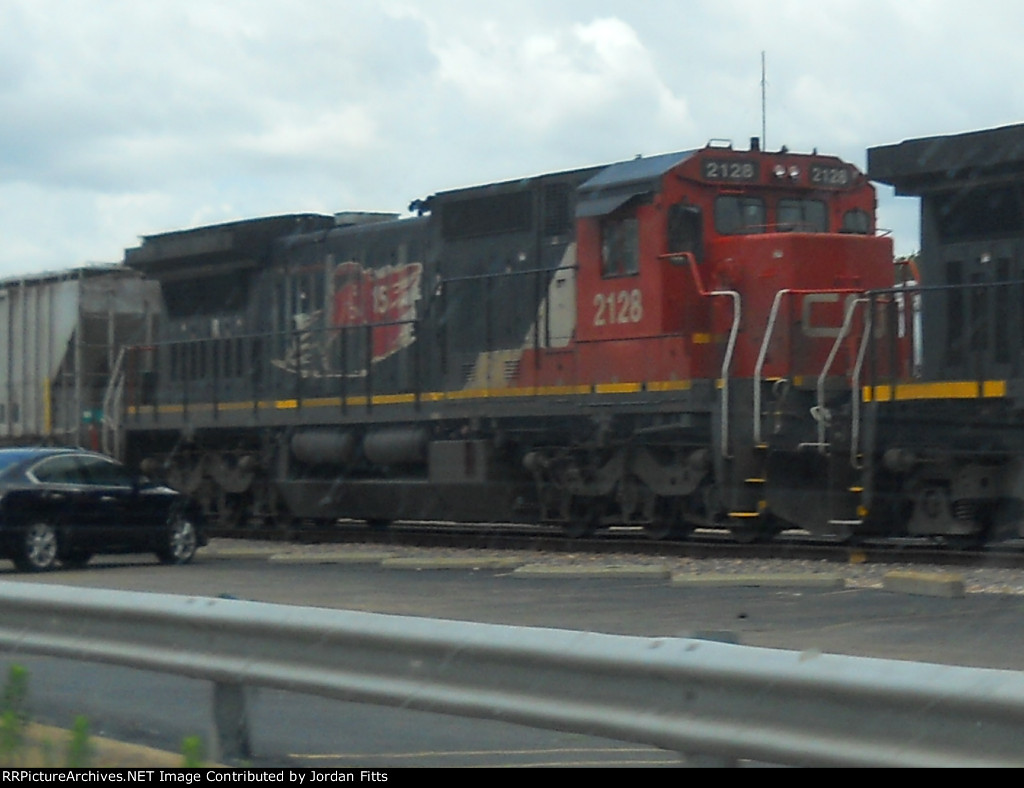 CN C40-8 2128 trails on a northbound grain train